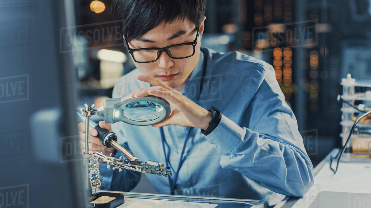 Close Up of a Professional Japanese Electronics Development Engineer in ...