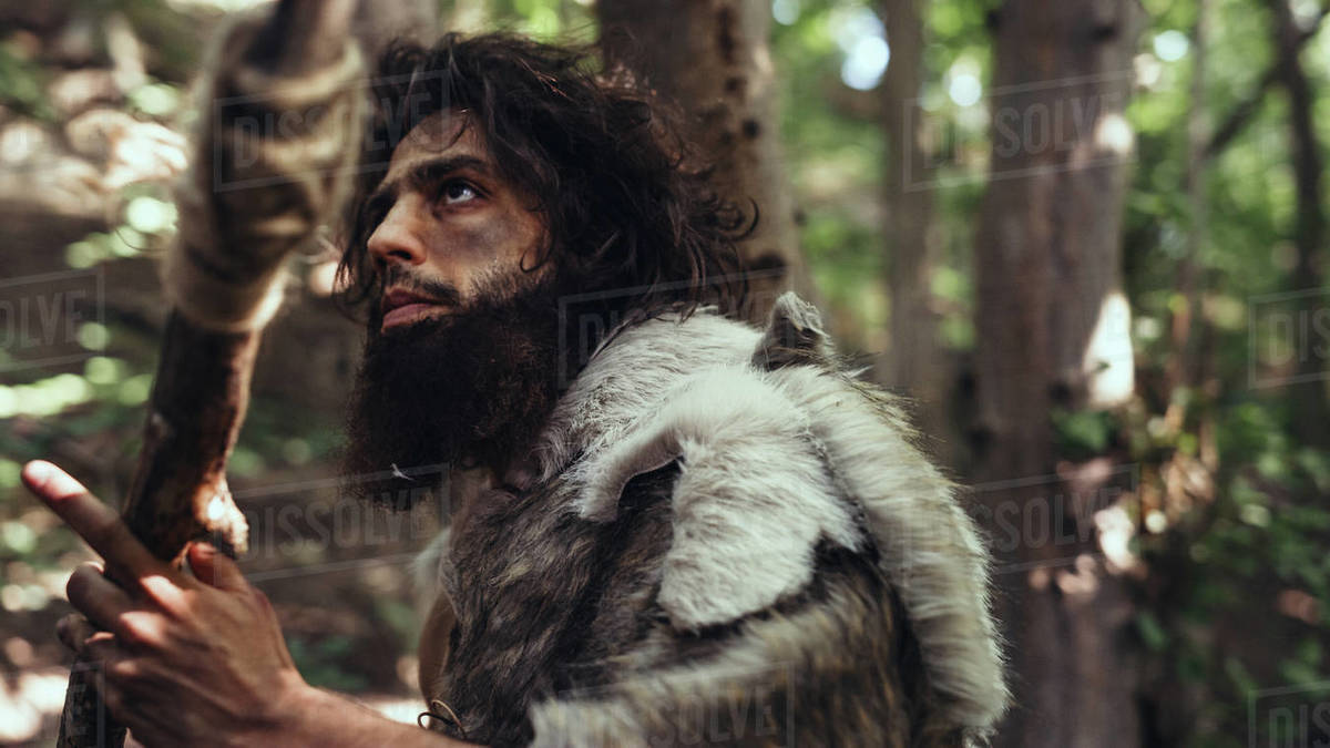 Close-up Portrait of Primeval Caveman Wearing Animal Skin and Fur ...