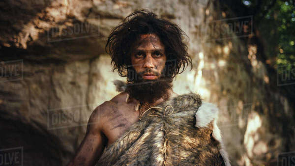 Portrait of Primeval Caveman Wearing Animal Skin Holding Stone Tipped ...