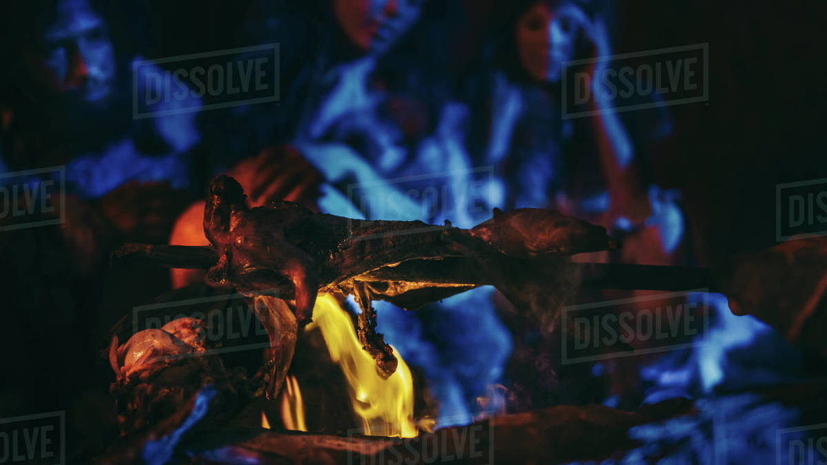 Neanderthal or Homo Sapiens Family Cooking Animal Meat over Bonfire and ...