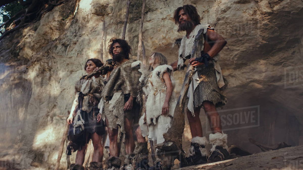Tribe of Hunter-Gatherers Wearing Animal Skin Holding Stone Tipped ...