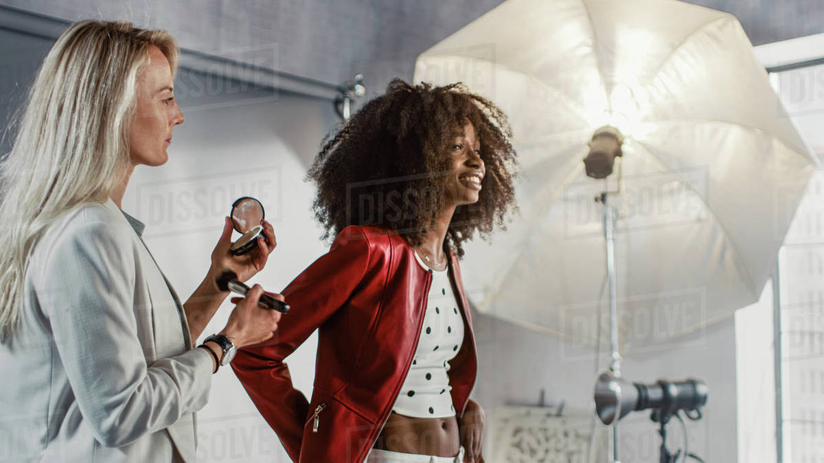 Backstage of the Photo Shoot: Make-up Artist Applies Makeup on a Young ...