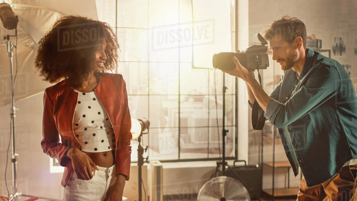 Beautiful Black Model Posing for a Photographer, he Takes Pictures with ...