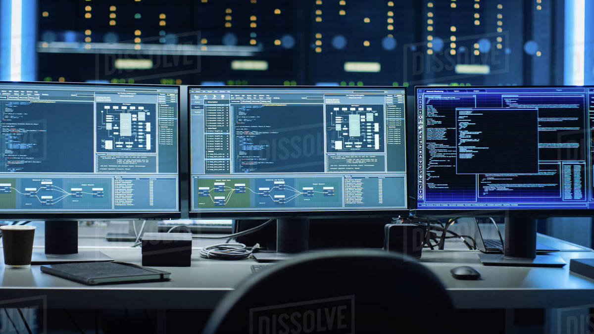 Shot of Multiple Personal Computer Monitors Showing Coding Language Program with System ...