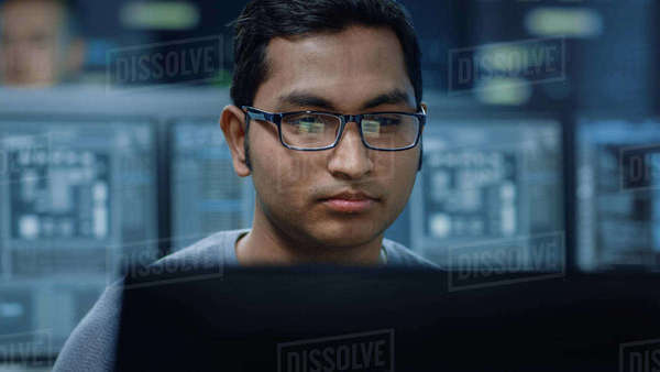 Portrait of a Smart and Handsome IT Specialist Working on a Personal ...