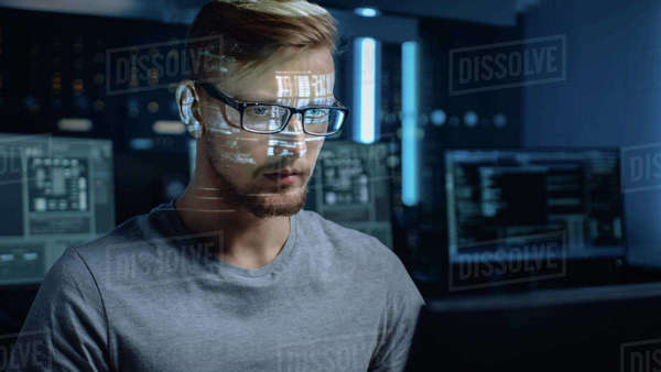 Portrait of Software Developer / Hacker Working on Computer, Projected ...