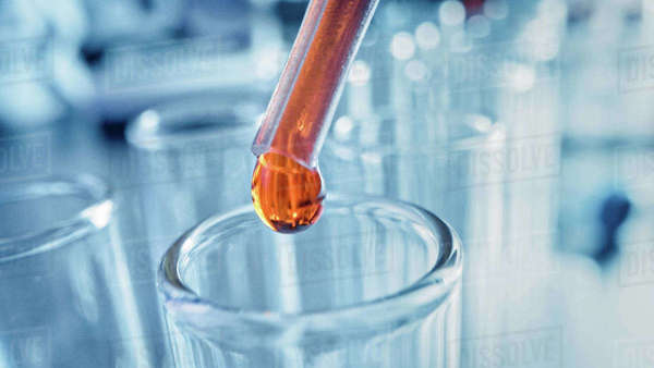 Pharmaceutics Laboratory: Pipette Dropping Red / Orange Liquid into ...