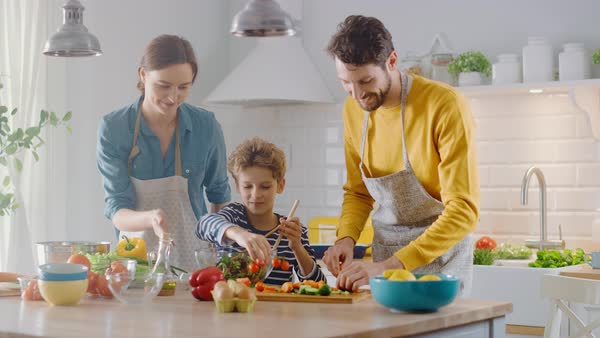 In Kitchen: Father and Cute Little Boy Cooking Together Healthy Dinner ...