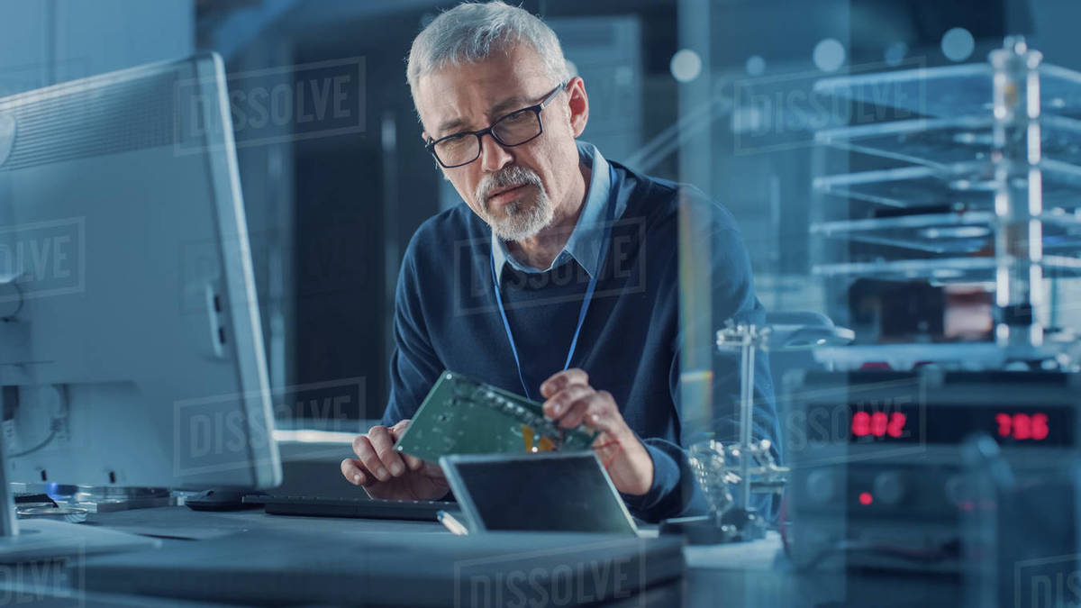 Electronics Maintenance Engineer Soldering Motherboard, Microchip and ...