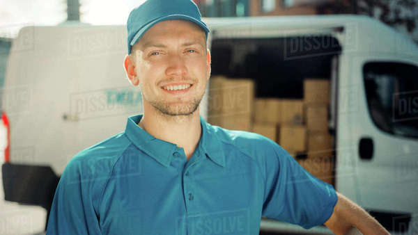 Portrait of Handsome Delivery Man Holds Cardboard Box Package Standing ...