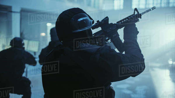 Portrait of Masked Armed SWAT Police Officer Storming Dark Seized ...