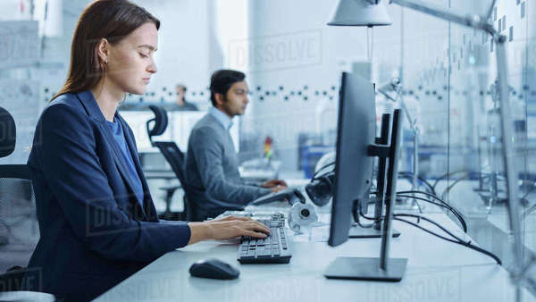 Portrait of Young and Confident Industrial Engineer Working on Computer ...