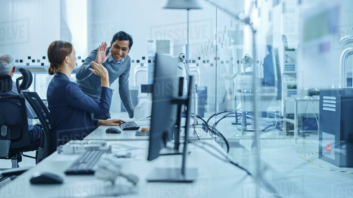 Inside Factory Office: Male Project Supervisor Talks to a Female ...