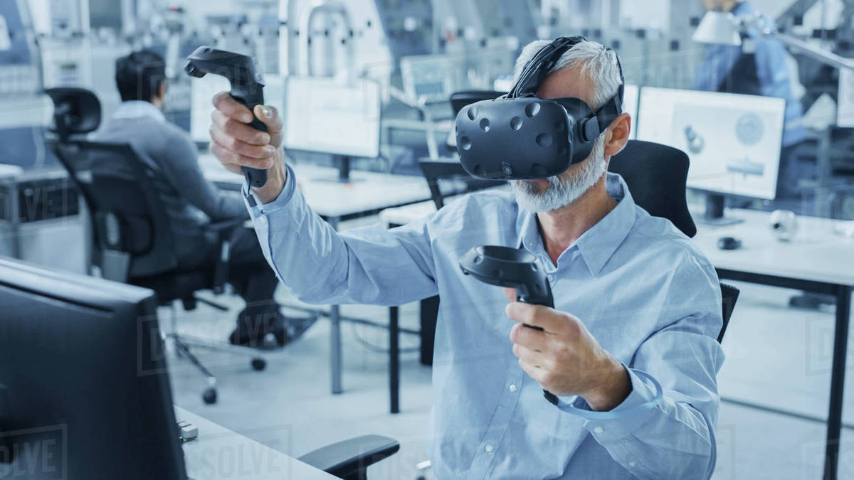 Industrial Design Engineer Wearing Virtual Reality Headset and Holding ...