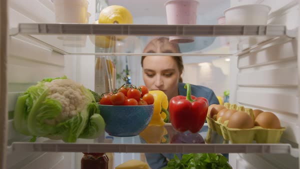 Beautiful Young Woman Opens Fridge Door, Looks inside Takes out ...