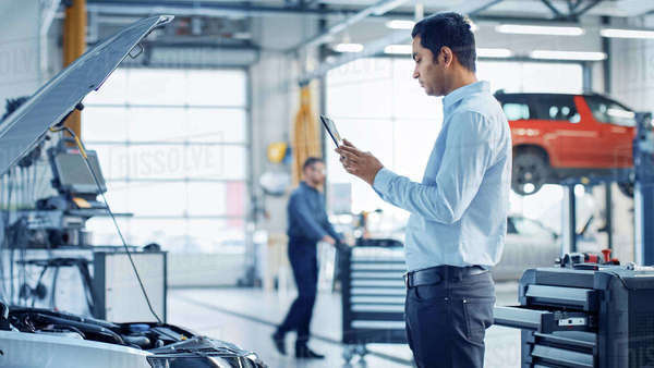 Car Service Manager Uses a Tablet Computer with an Augmented Reality ...