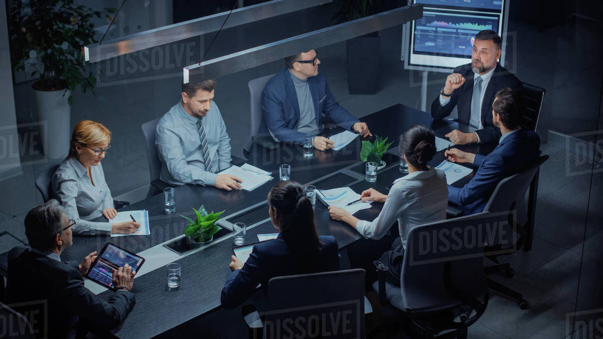 In the Corporate Meeting Room: Diverse Group of Business Associates and ...