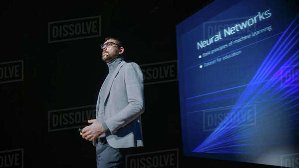 Tech Conference Stage: Speaker Talks about Product. Neural Networks ...