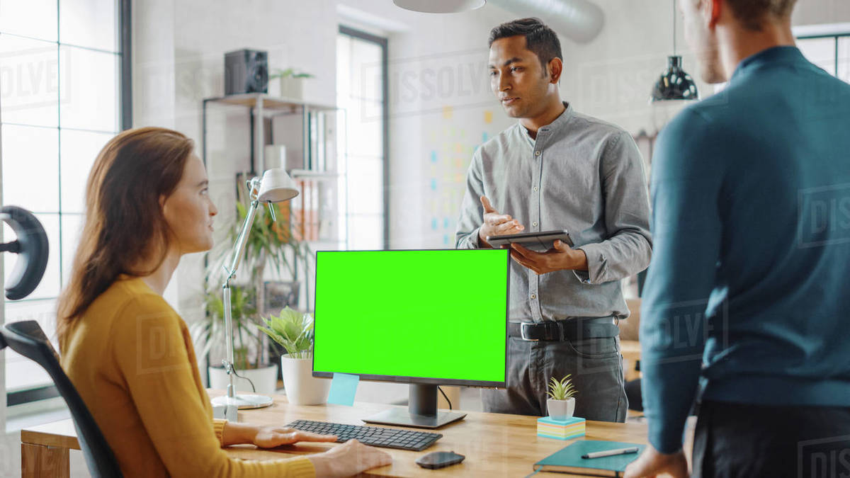 Three Start-up Entrepreneurs Work on Desktop Computer with Green Mock ...