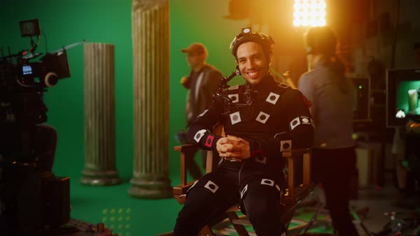 Handsome Smiling Actor Wearing Motion Capture Suit and Head Rig having ...