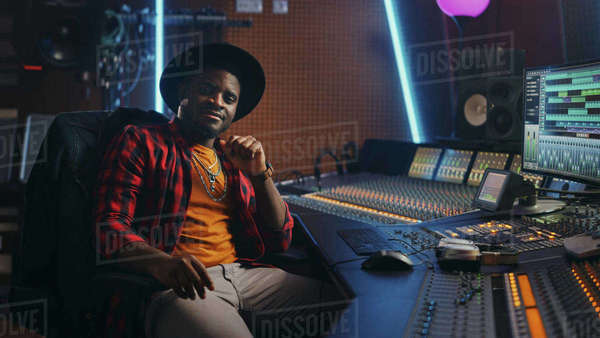 Stylish Audio Engineer Working in Music Recording Studio, Uses Mixing ...