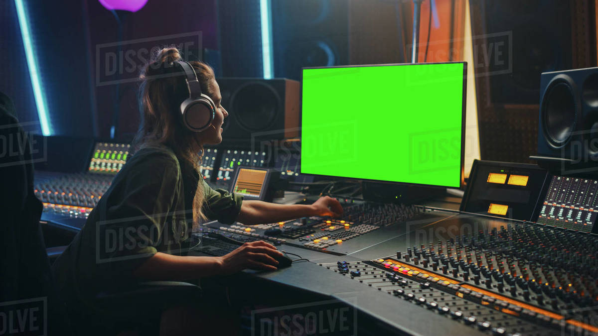 Stylish Female Audio Engineer / Producer Working in Music Record Studio ...