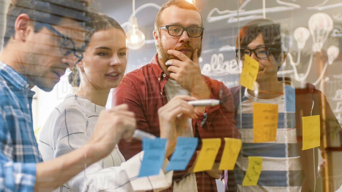 Diverse Team of Young Developers Brainstorming, They Have Discussion ...