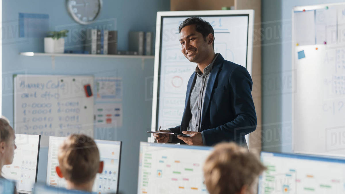 Elementary School Computer Science Class: Teacher Uses Digital Tablet ...