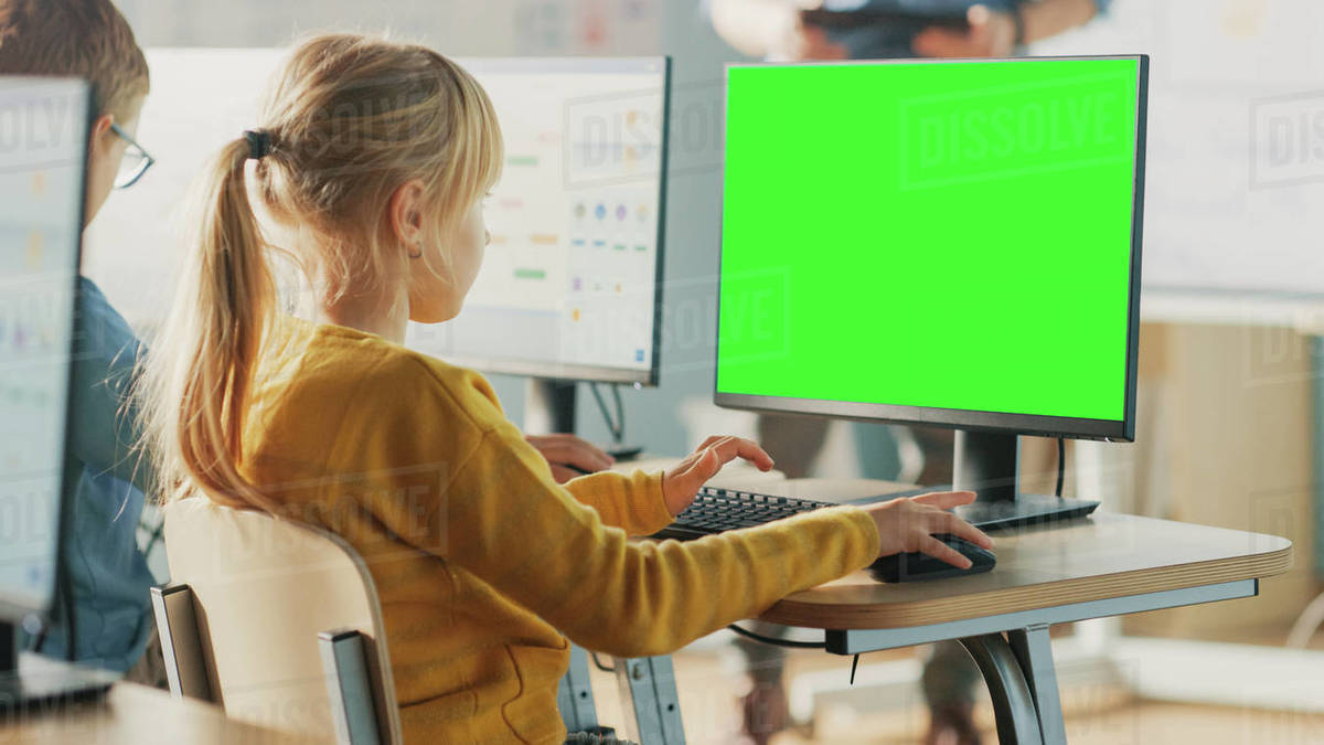 Elementary School Computer Science Classroom: Cute Little Girl Uses ...