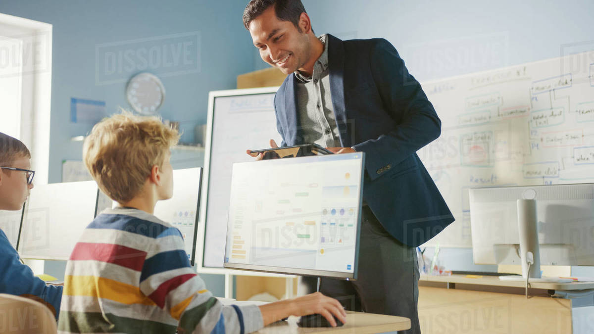 Elementary School Computer Science Classroom: Teacher Uses Tablet ...