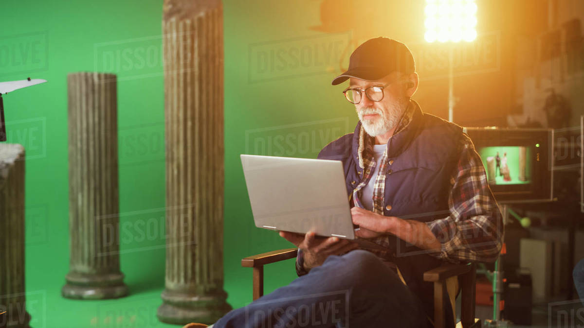 Prominent Successful Director Sitting in a Chair on a Break Using ...