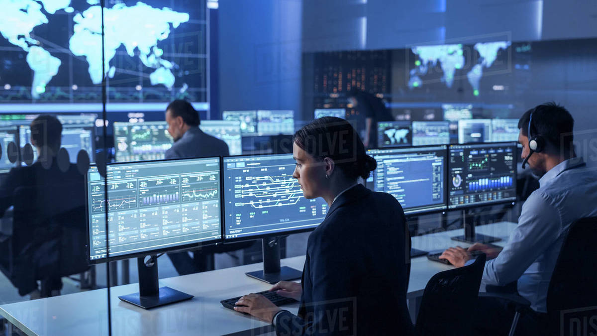 Team of Professional Computer Data Science Engineers Work on Desktops ...