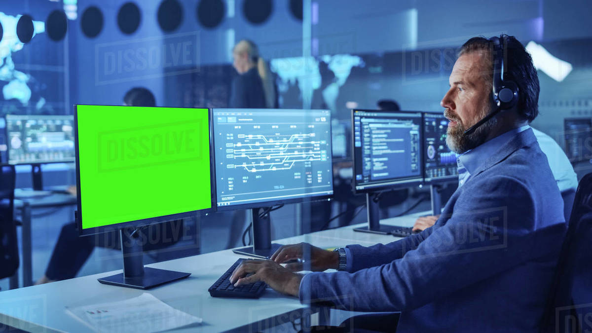 Confident Male Data Scientist Works on Computer with Green Screen Mock ...