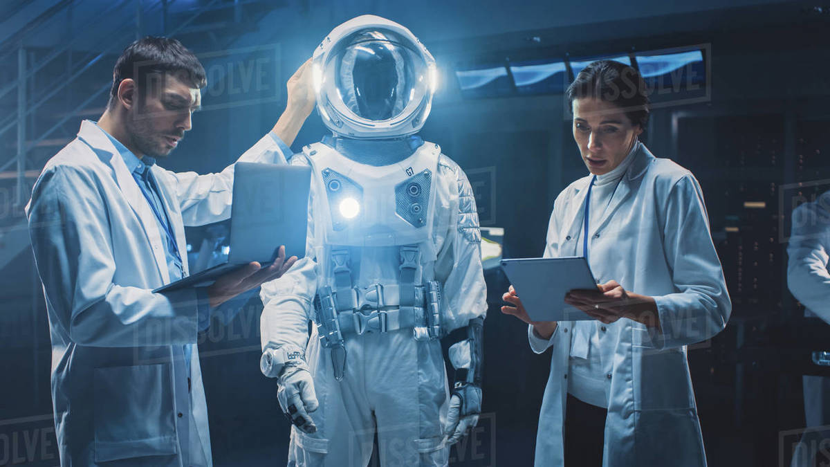 Diverse Team of Aerospace Scientists and Engineers Wearing White Coats ...