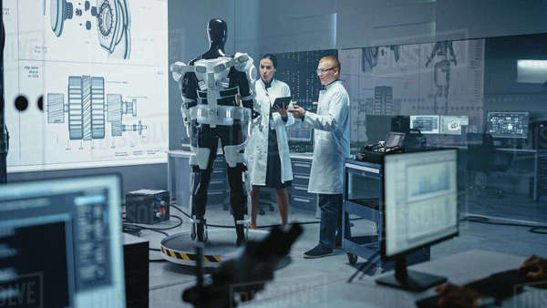 In Robotics Development Laboratory: Chief Female Engineer and Top Male ...