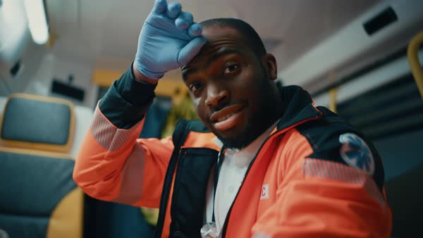 Happy Black African American Paramedic Smiles and Poses for Camera in ...