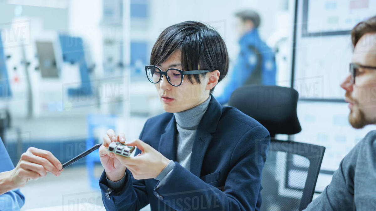 Factory Office Meeting Room: Asian Computer Design Specialist Holds ...