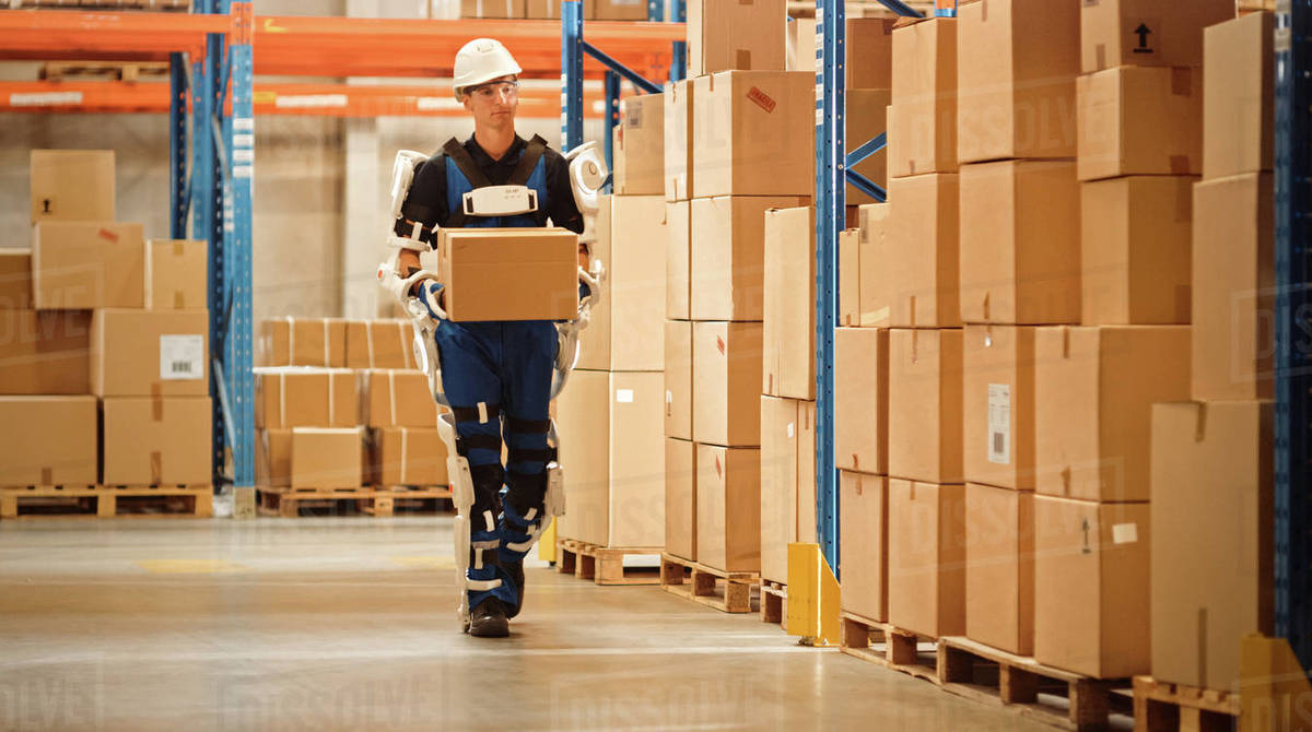 High-Tech Futuristic Warehouse: Worker Wearing Advanced Full Body ...