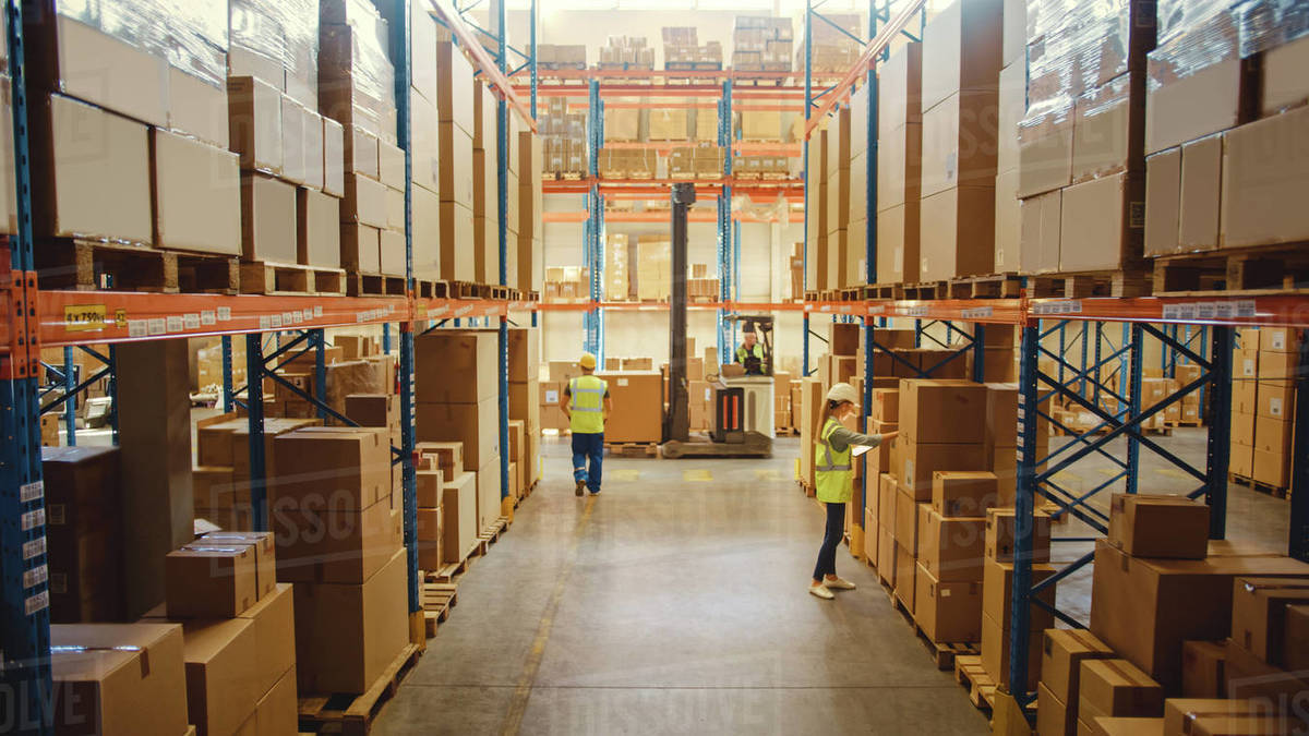 Retail Warehouse full of Shelves with Goods in Cardboard Boxes, Workers ...