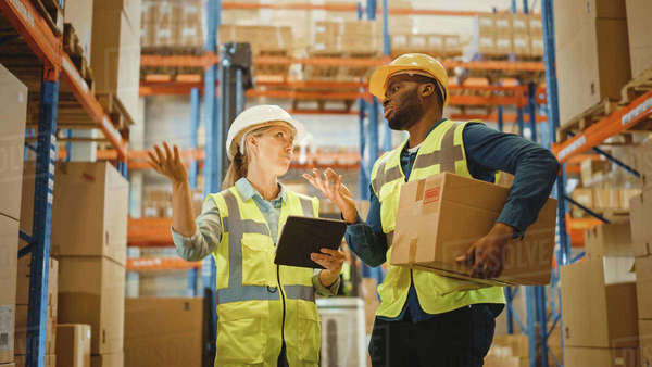 Retail Warehouse full of Shelves with Goods in Cardboard Boxes, Male ...