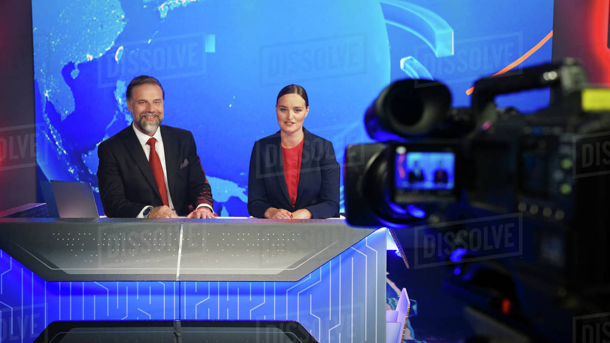 Live News Studio with Professional Anchors doing Report - Royalty-free ...