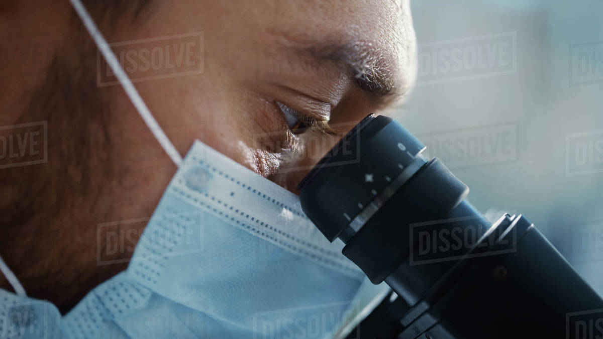 Macro Close Up Shot of a Male Scientist Wearing Medical Mask and ...