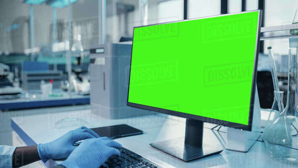 Modern Medical Research Laboratory: Scientist working on Computer ...