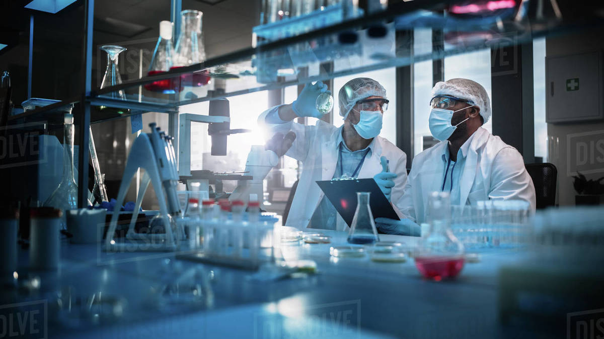 Modern Medical Research Laboratory: Two Scientists Wearing Face Masks ...