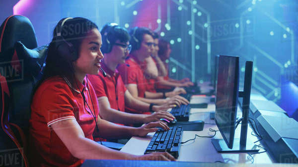 Diverse Esport Team of Pro Gamers Play in Video Game on a Championship ...