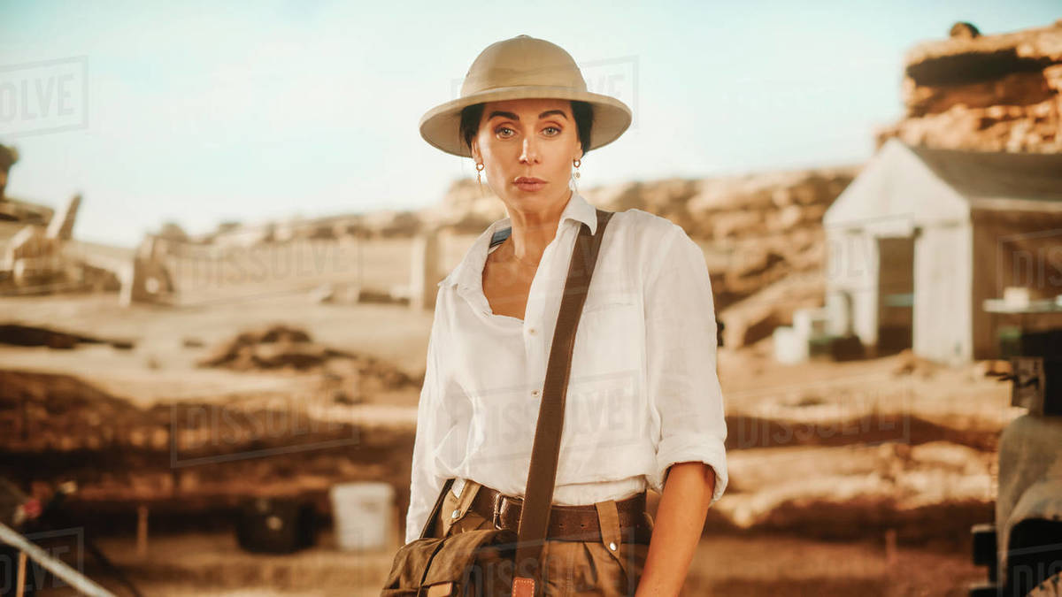 Female Adventurer Posing and Looking at Camera - Stock Photo - Dissolve