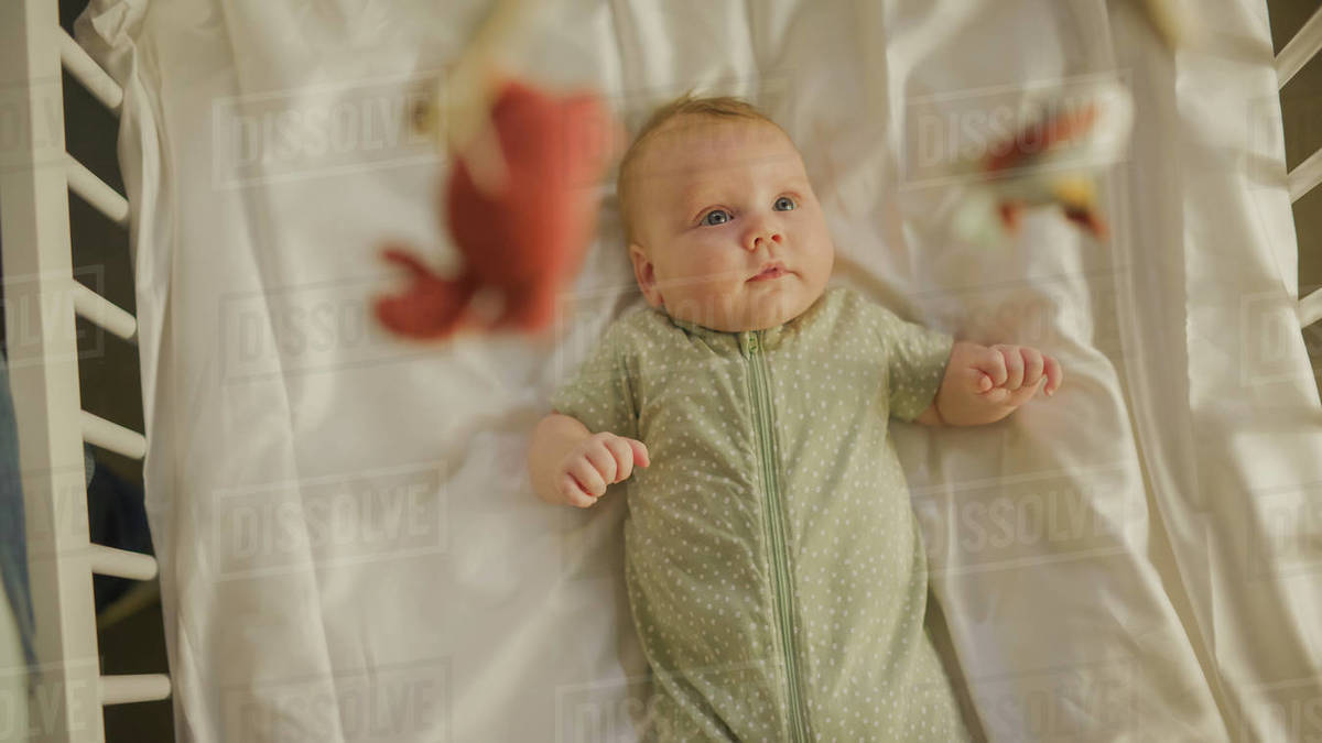 Authentic Close Up Shot of a Newborn Baby Lying on the Back in Child ...