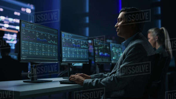 Confident Male Data Scientist Works on Personal Computer in Big ...