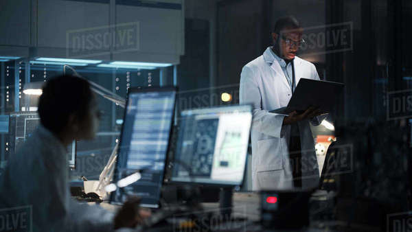 Professional Black Engineer Holding Laptop Computer Standing in the ...
