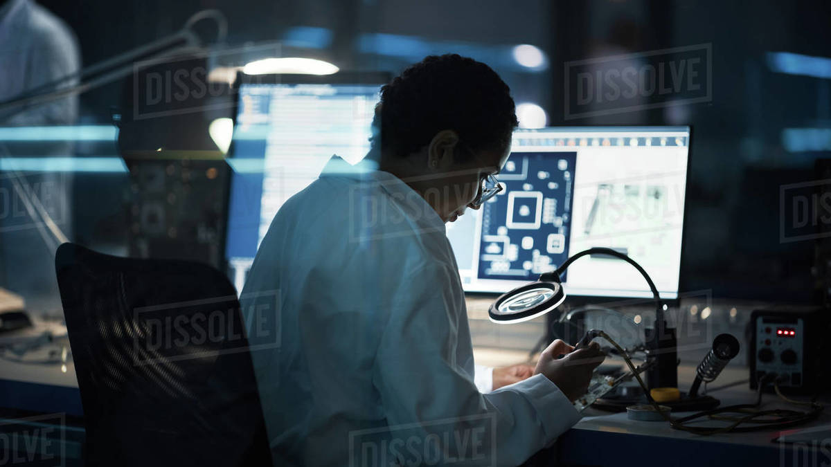 Black Female Engineer Does Computer Motherboard Soldering - Royalty ...